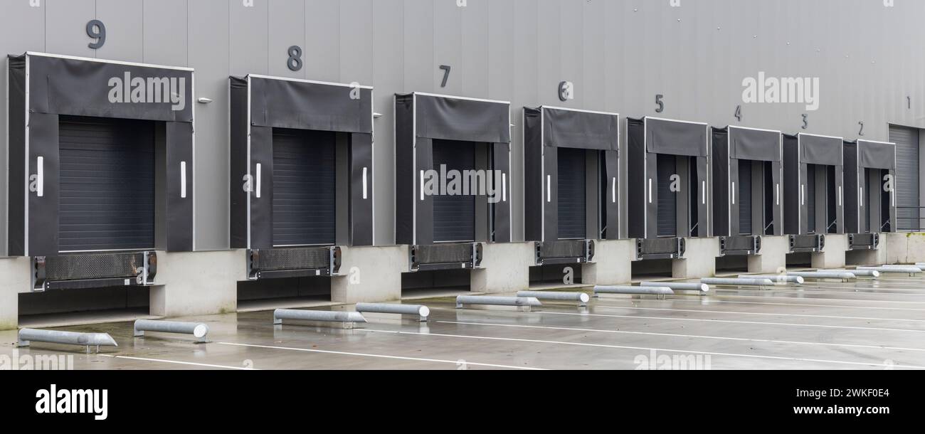 Row of gray loading docks of a warehouse or distbution center Stock ...