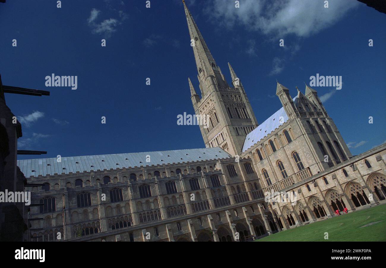 A tilted angle shot of the Norwich Cathedral with its magnificent spire ...