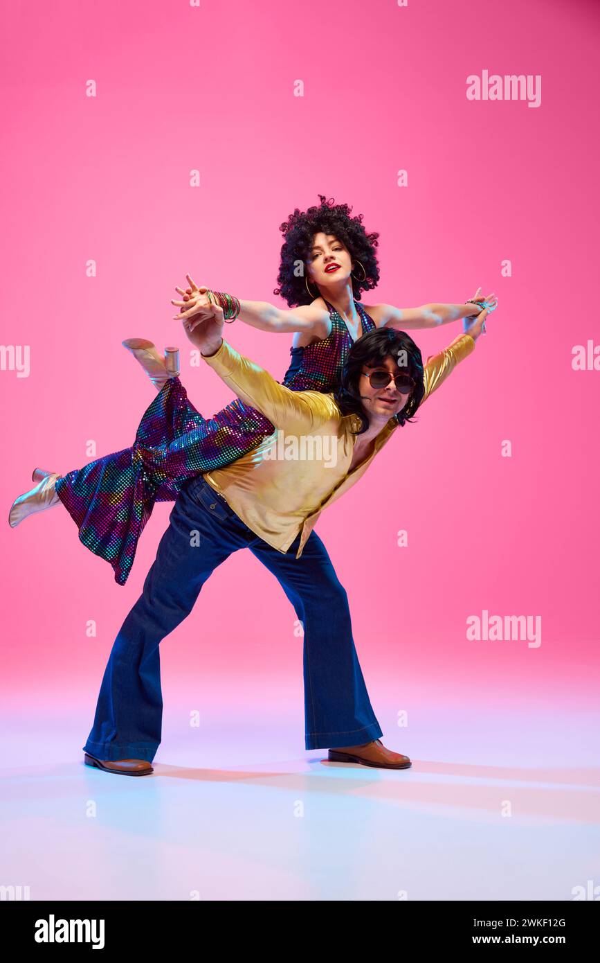 Disco dancing couple in dynamic lift pose vibrant retro style outfit ...