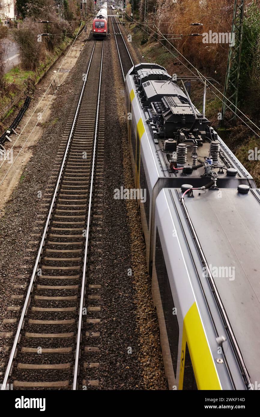 Two trains parked closely on parallel tracks Stock Photo - Alamy