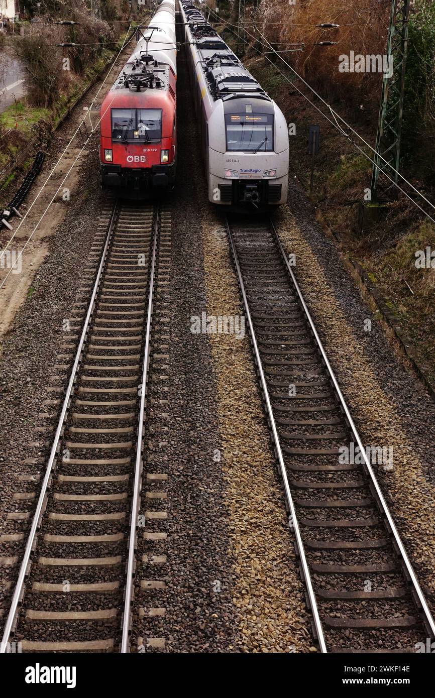Two trains parked closely on parallel tracks Stock Photo - Alamy