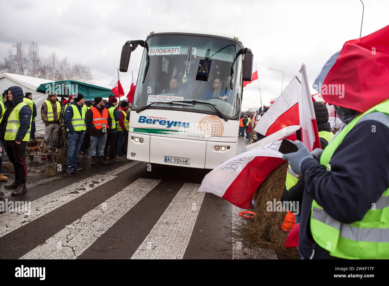 Polish farmers let through a Ukrainian bus at the Dorohusk border ...