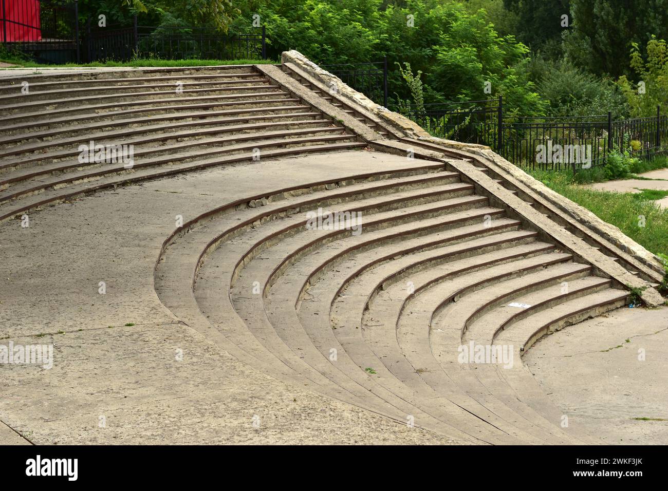 A semicircular staircase with numerous steps connects two levels in the ...