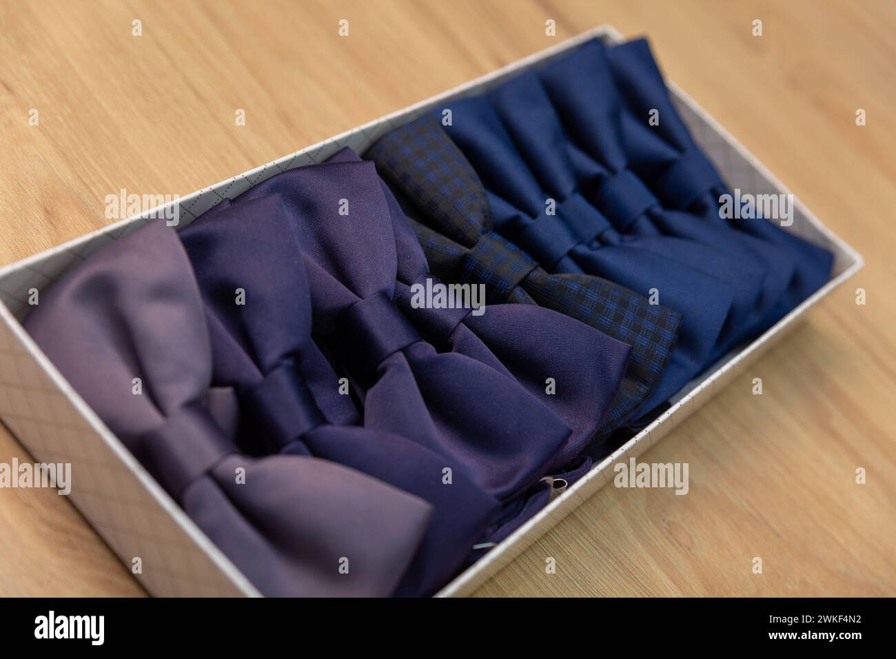 Showcase in a store with beautiful multi-colored bow ties. Many bright ...