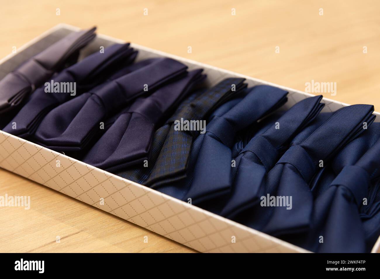 Showcase in a store with beautiful multi-colored bow ties. Many bright ...