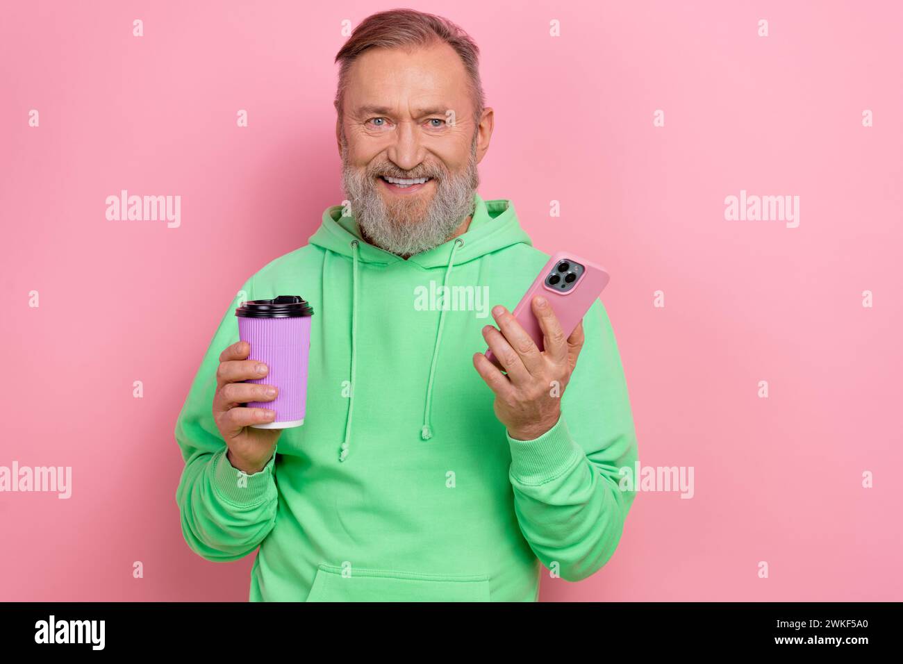 Photo of positive good mood guy dressed green hoodie enjoying coffee ...