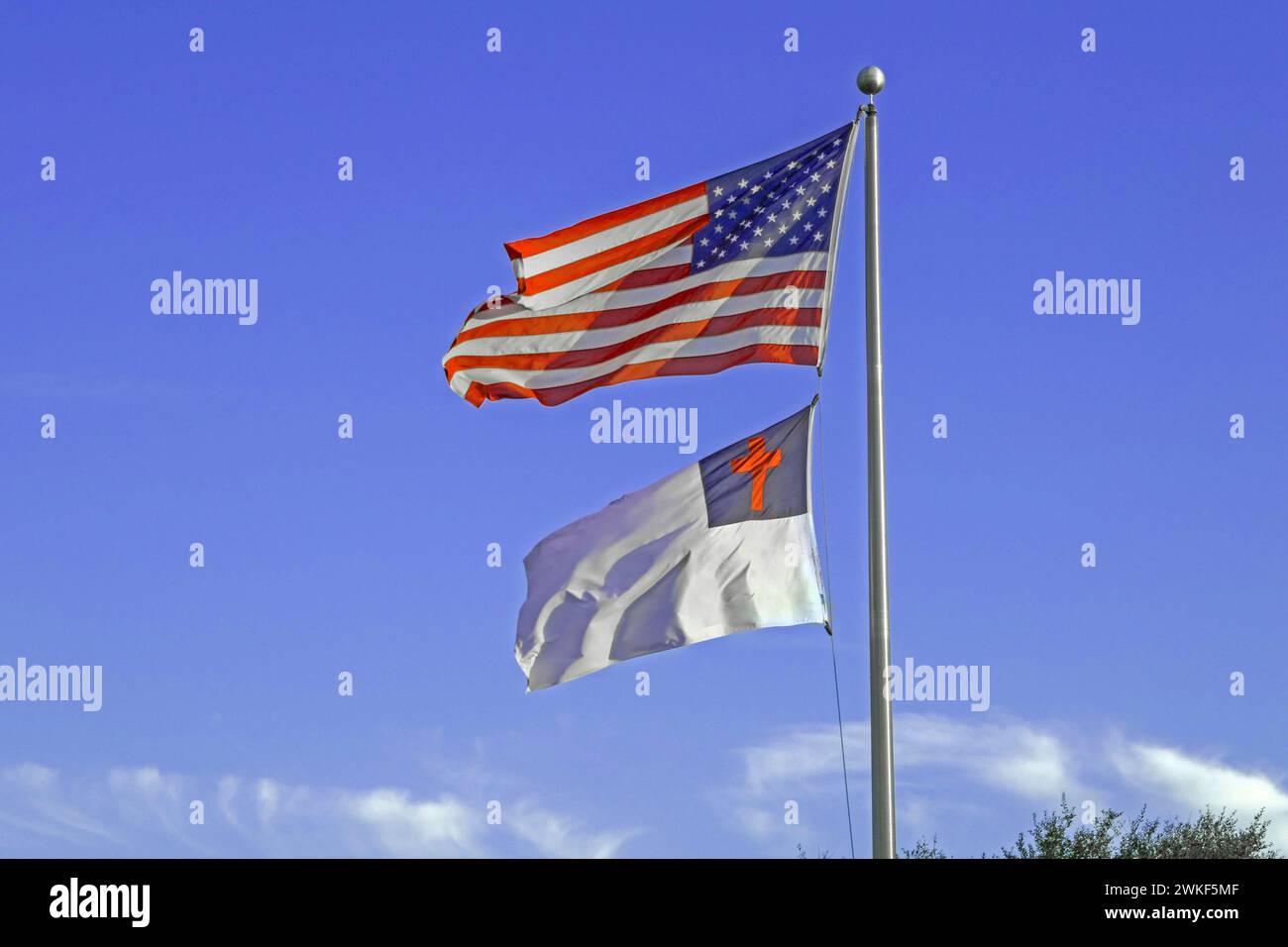 A Christian Flag flying underneath the American Flag at a Church in ...