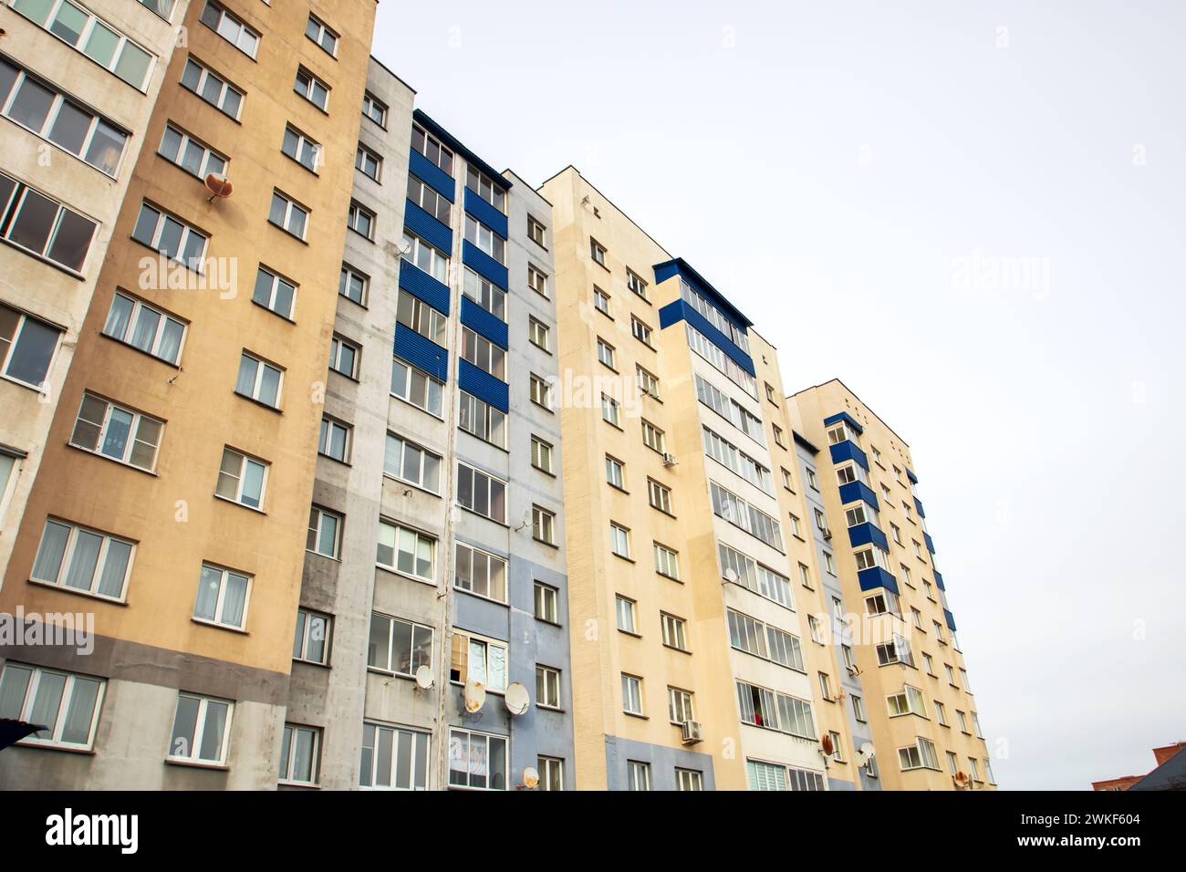 Windows of a multi-storey tall building against the background of the ...