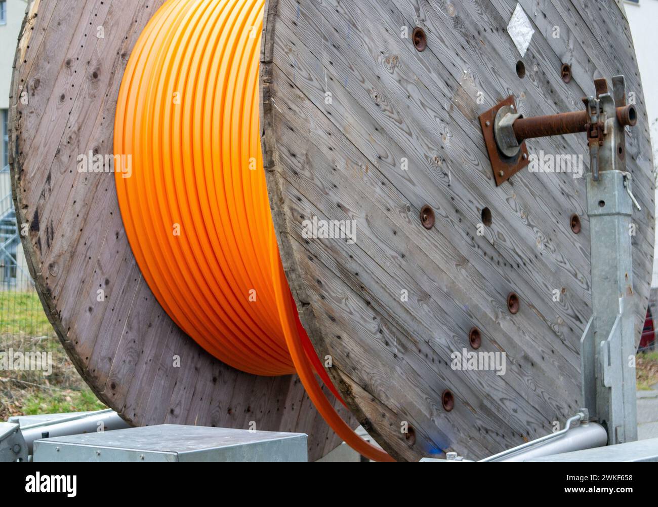 Cable reel on a construction site with an orange cable Stock Photo - Alamy