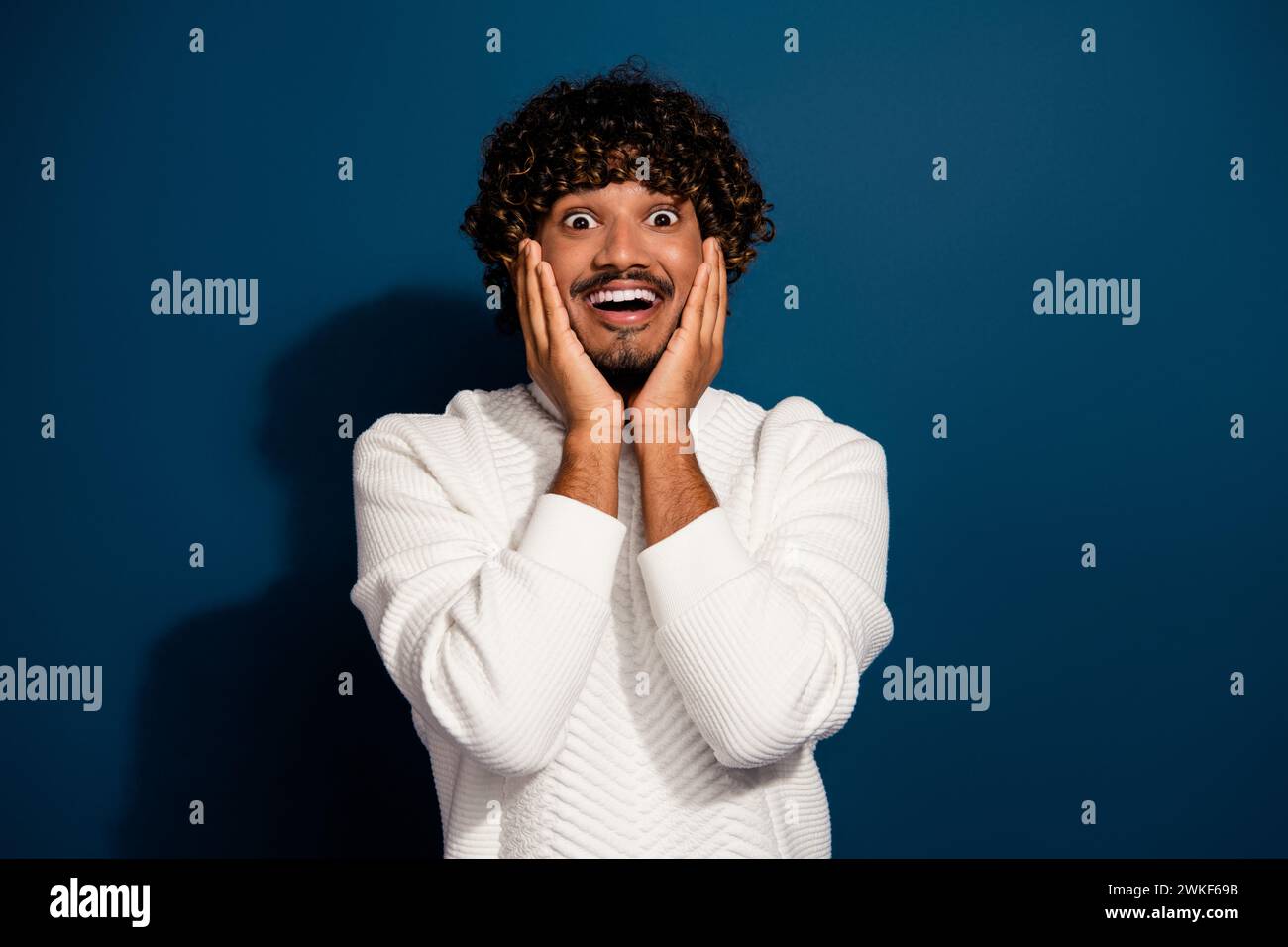 Portrait of young funny man touch cheeks when realize his girlfriend ...