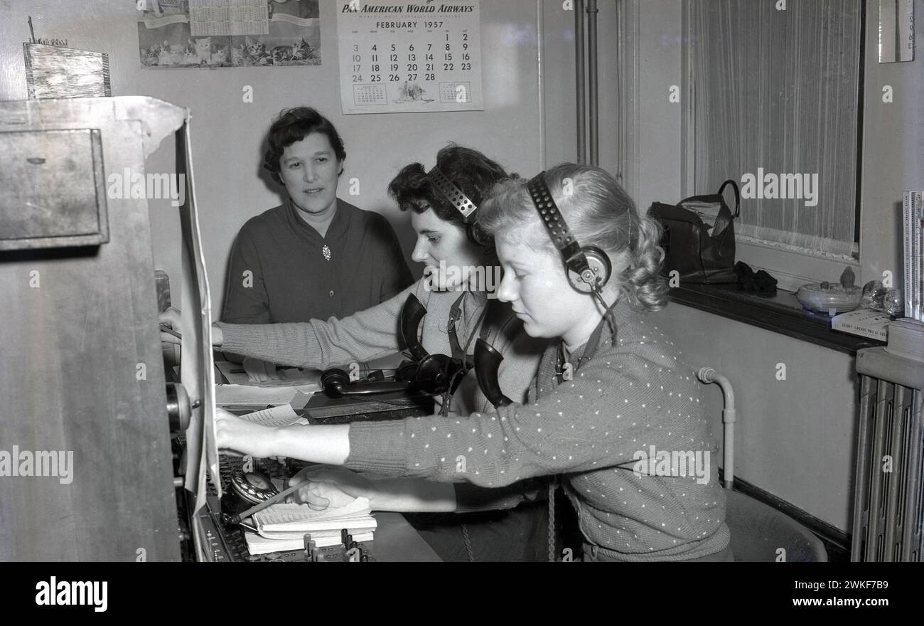 1957, historical, inside a room, two girls, wearing headphones ...