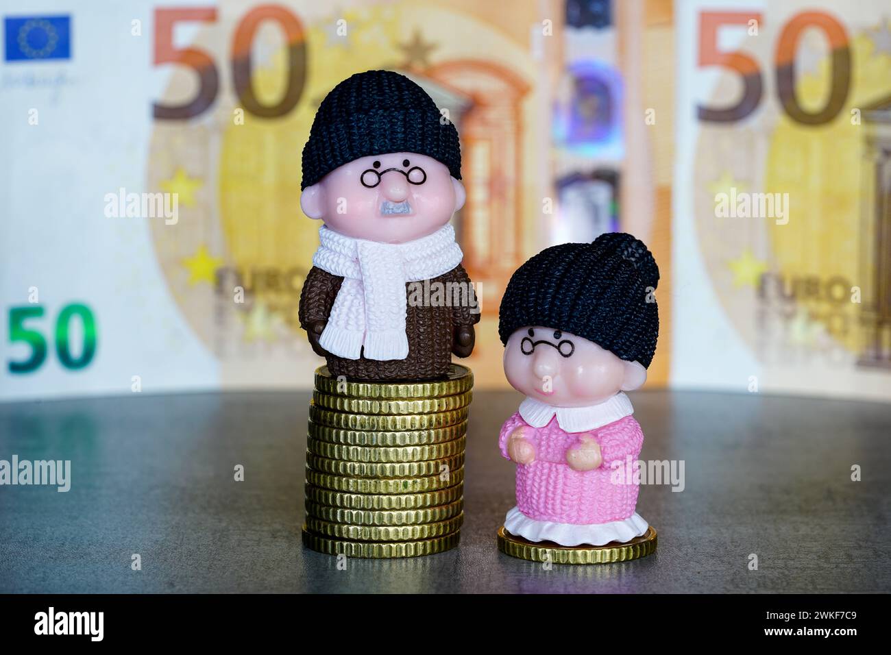 Figures of old retired people on piles of money coins of different ...