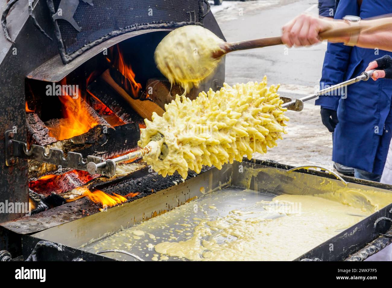 The traditional Lithuanian Polish spit cake is baked on a open fire at ...
