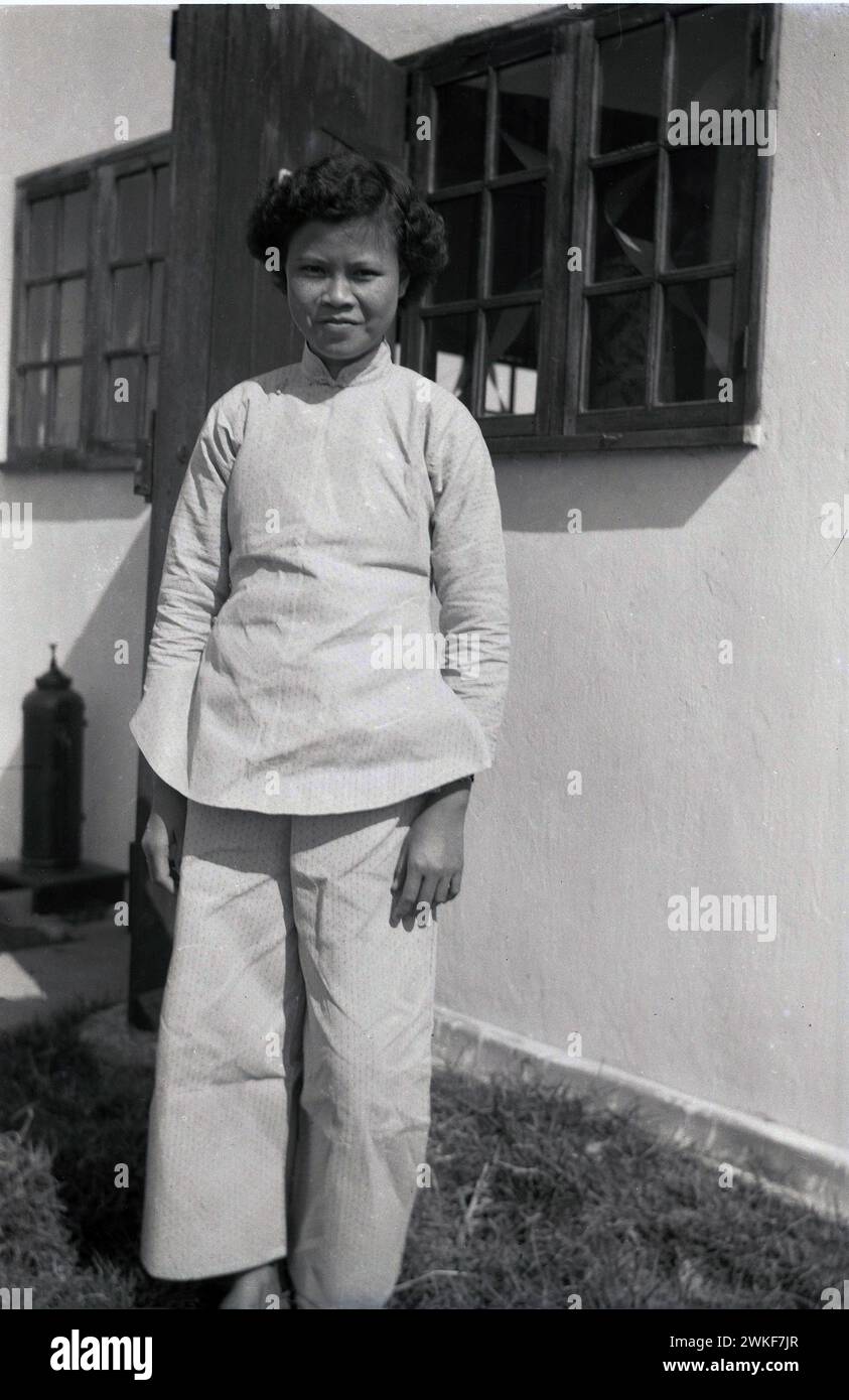 1960s, historical, a chinese lady in traditonal asian 2-piece outfit ...