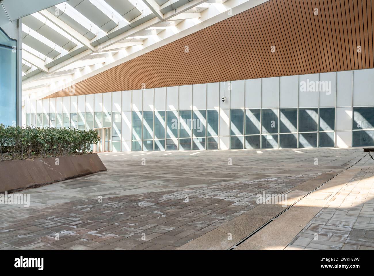 Empty concrete floor in front of modern buildings in the downtown ...