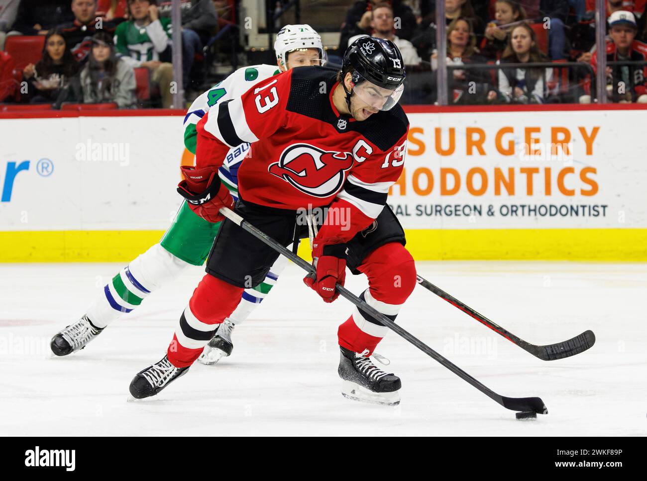 New Jersey Devils' Nico Hischier (13) handles the puck during an NHL ...