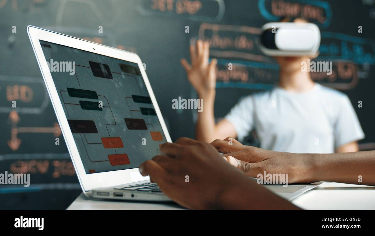 Closeup of african student hands coding or programing system at ...