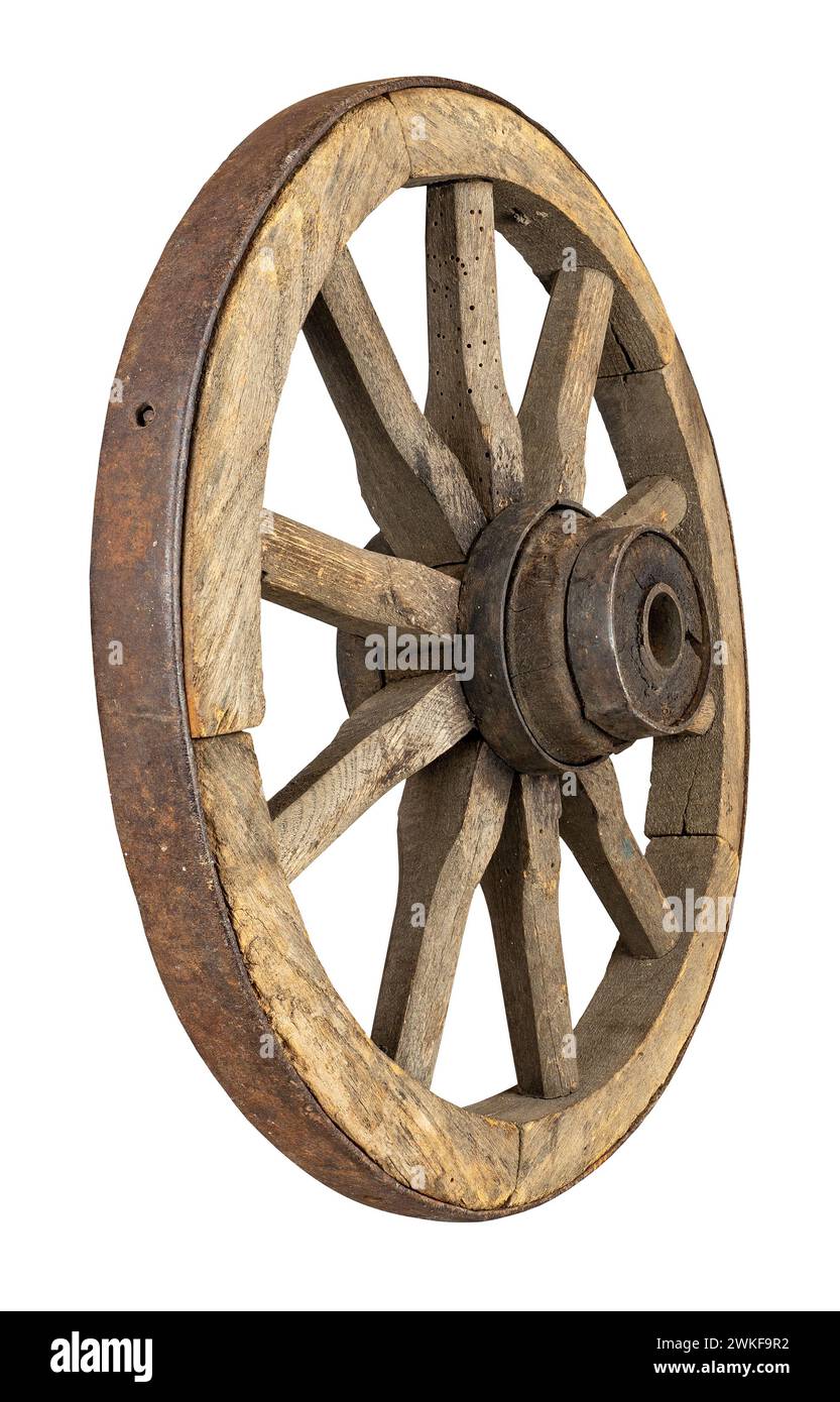 Old rustic wooden wagon wheel isolated on white background, perspective ...