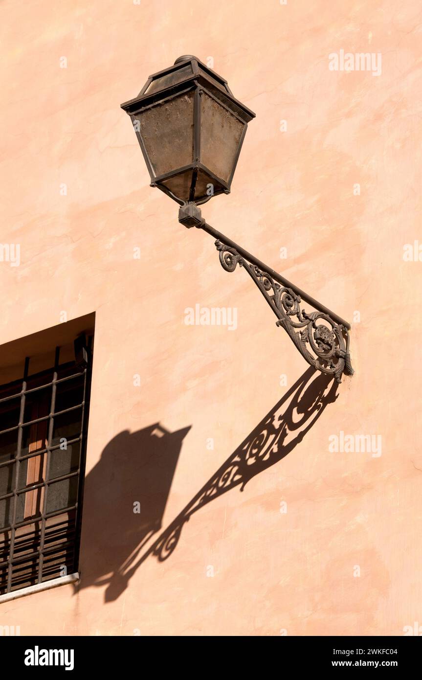 Street lamp on the wall in the historic center of Rome, Lazio, Italy ...