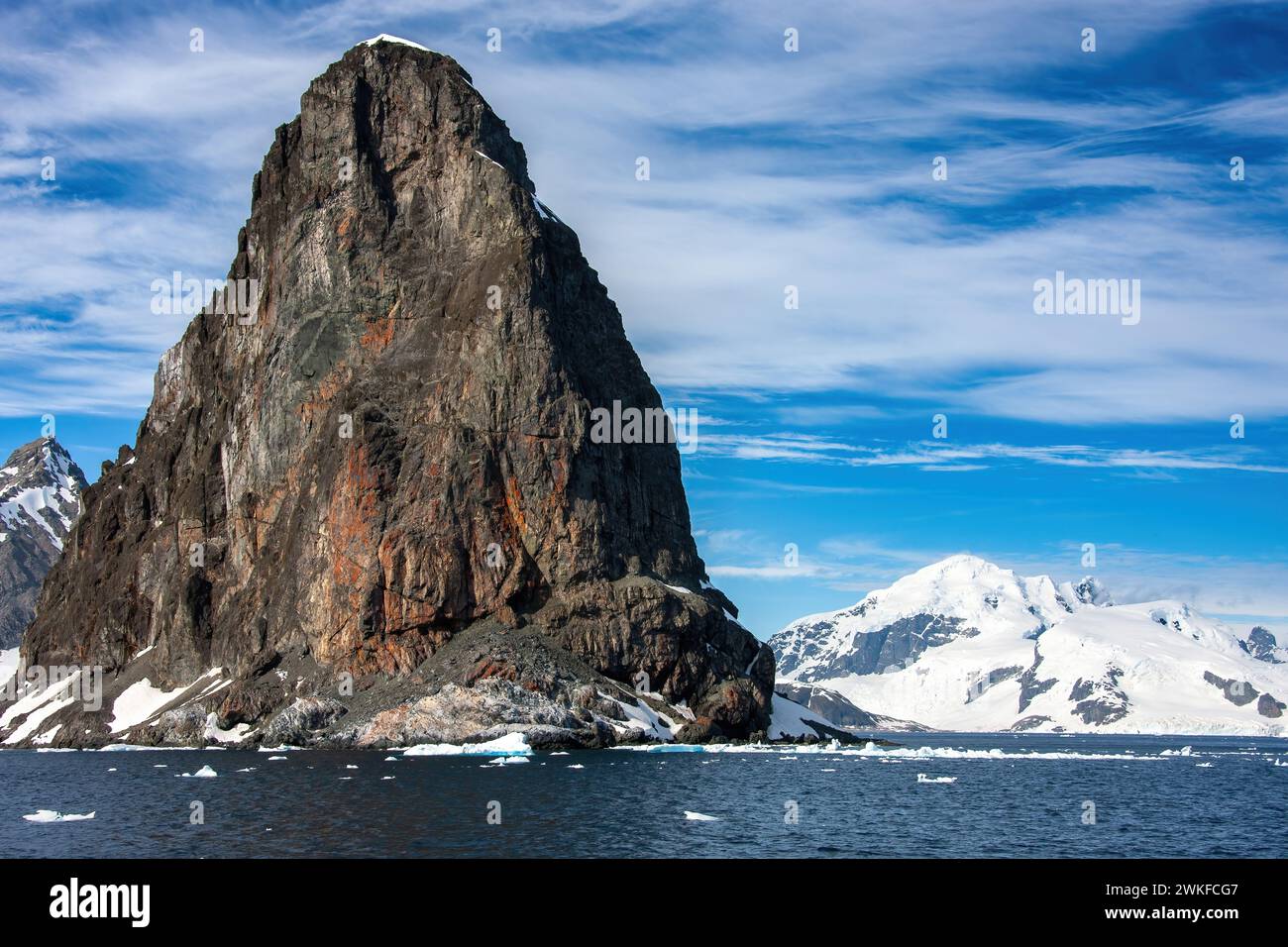 Basalt peak rising out of the ocean, Antarctic Peninsula, Antarctica ...