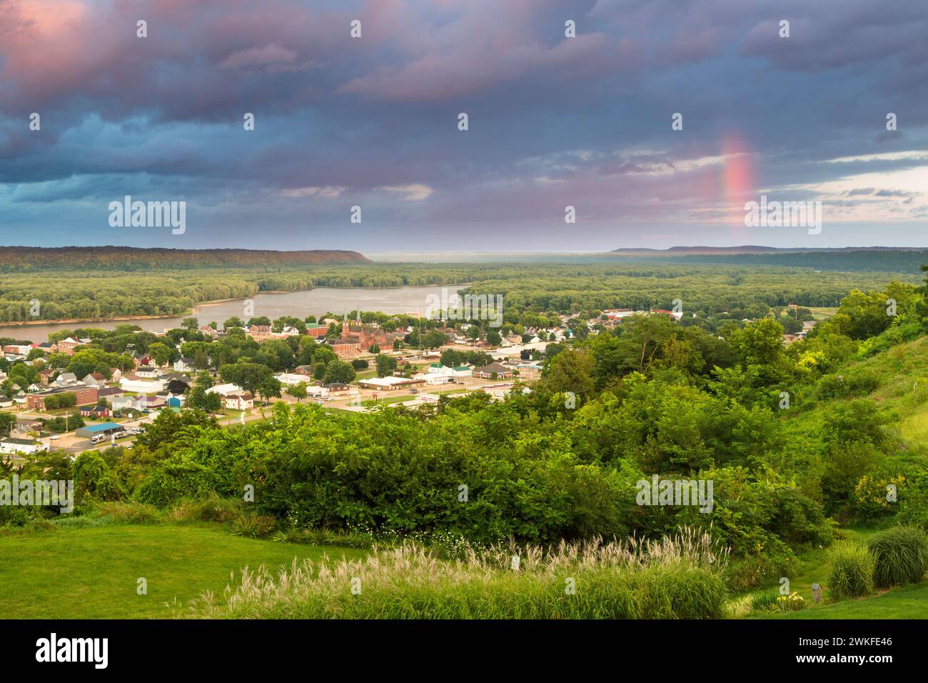Colorful clouds and a rainbow at sunset over Guttenberg, Iowa and the ...