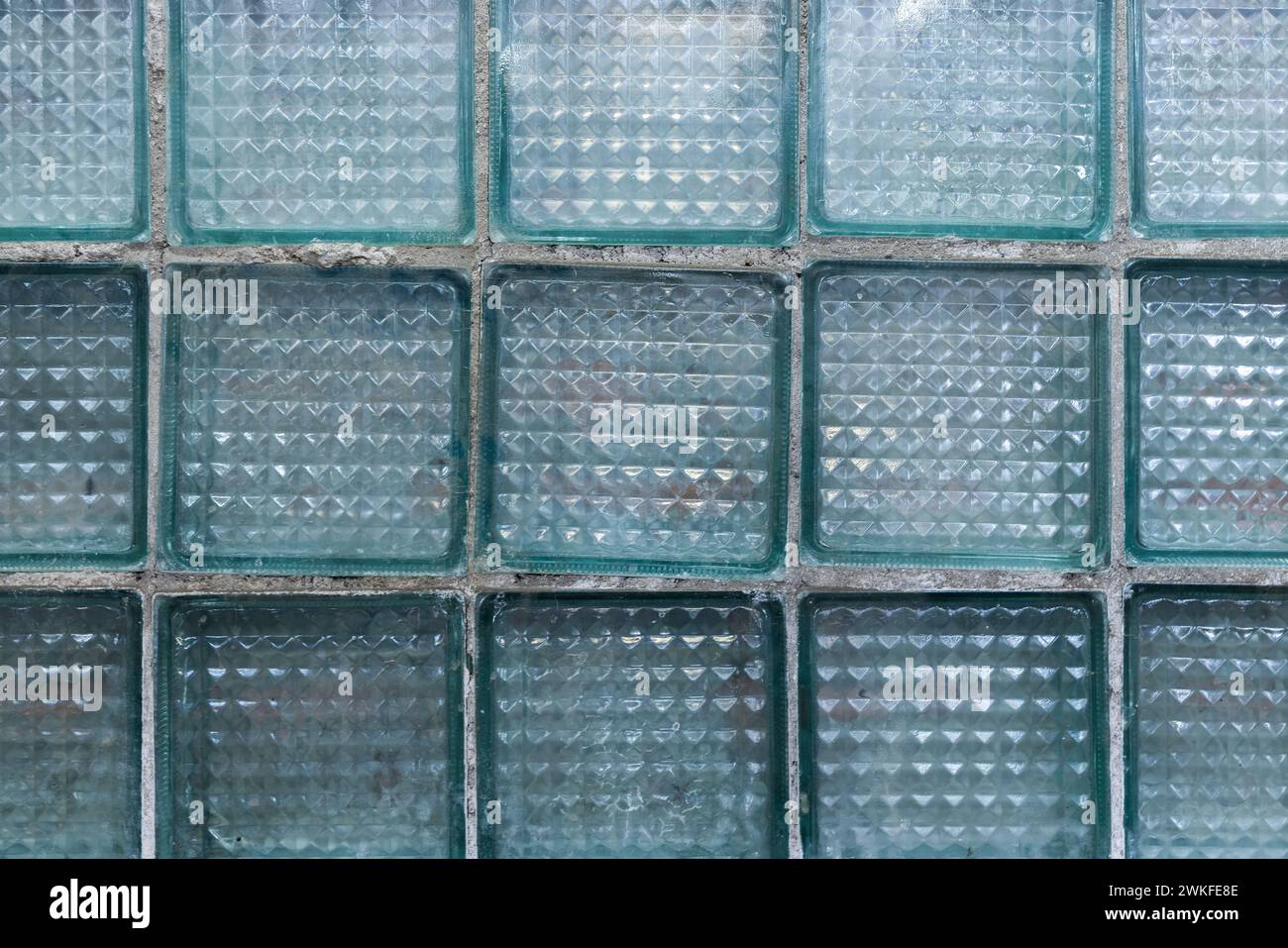 Rough transparent wall made of glass blocks, industrial architecture ...