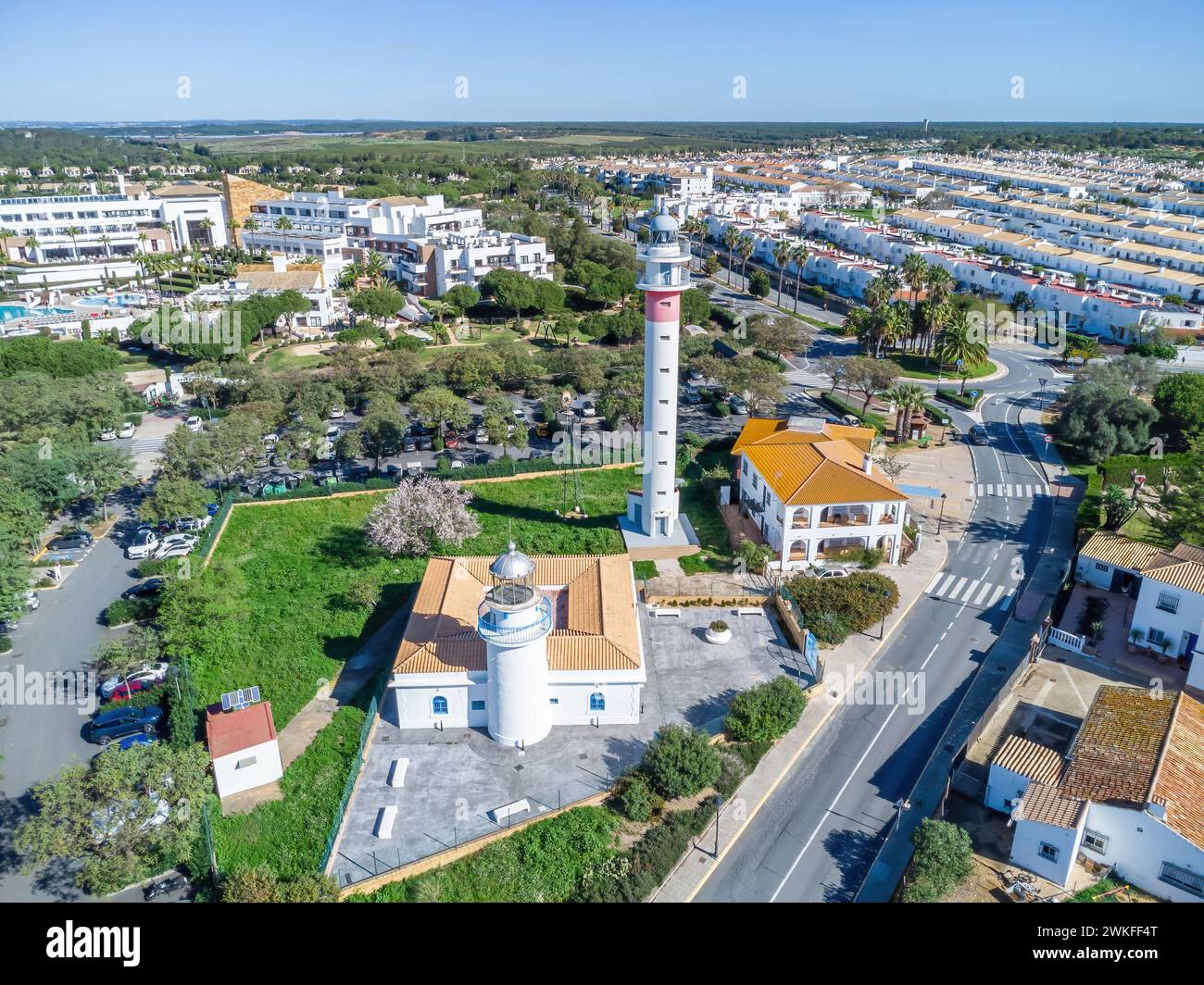 Aerial view of Lighthouse tower in the beach village El Rompido, in the ...