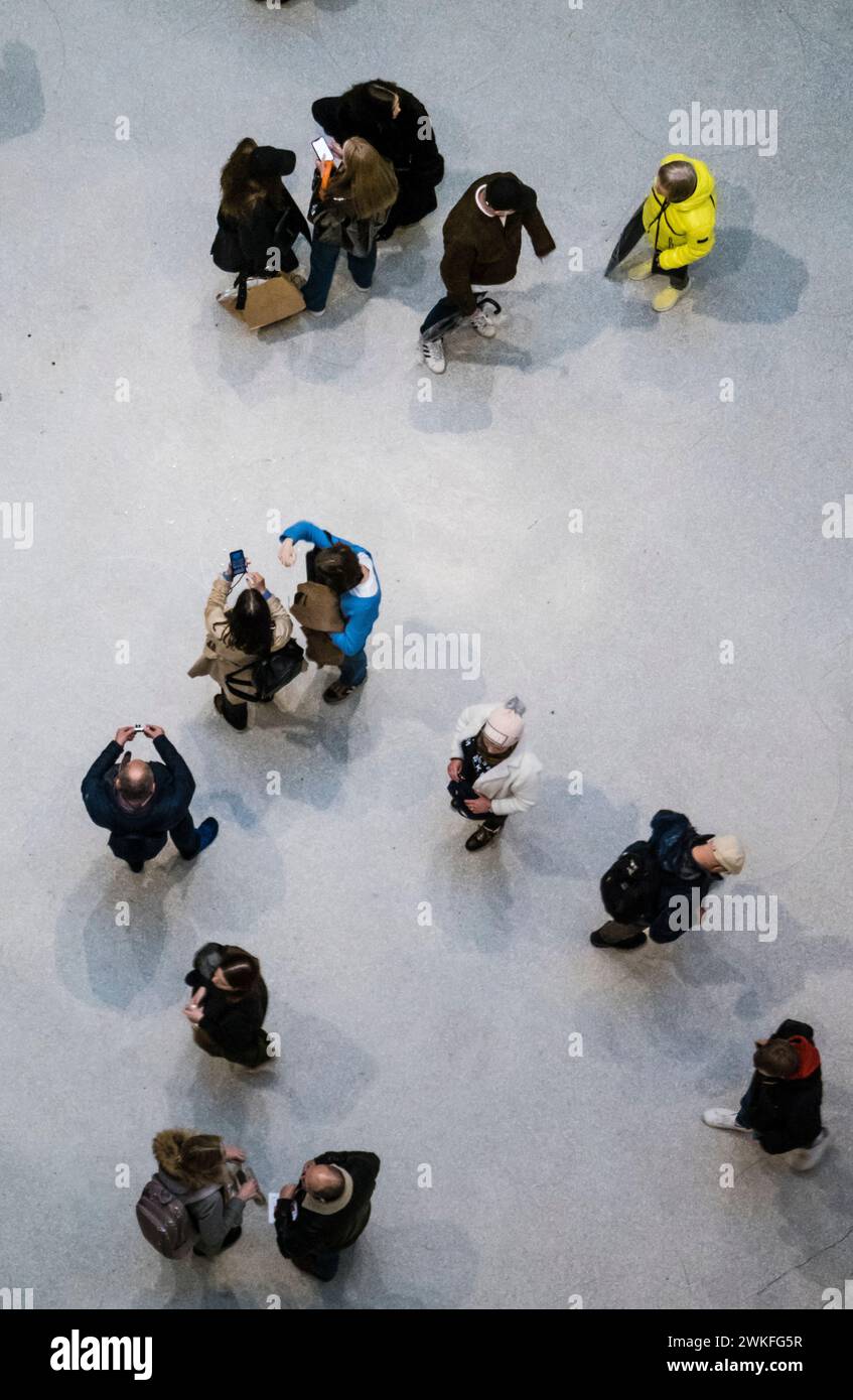 Visitors in a concourse seen from directly above (unrecognisable people ...