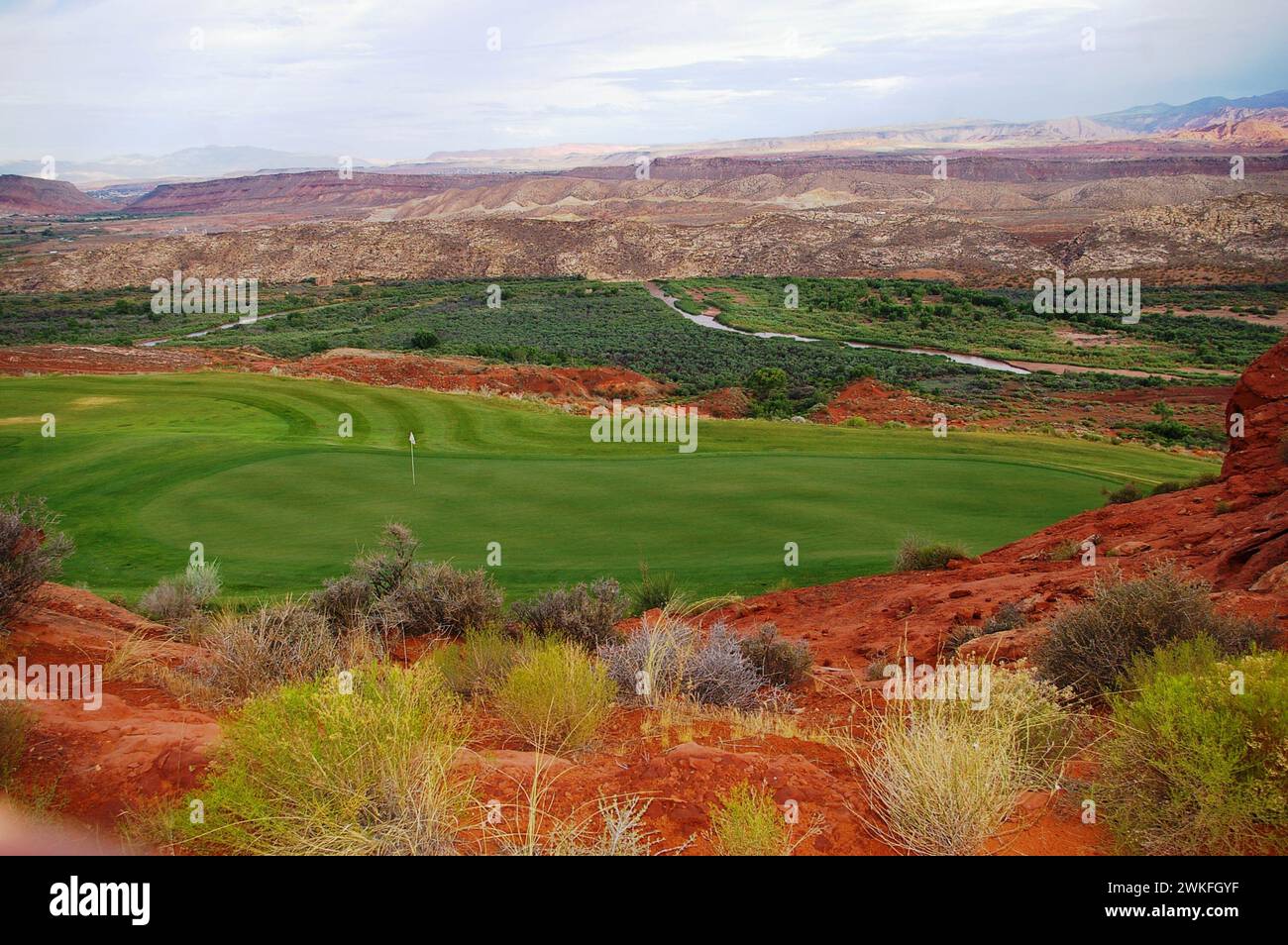 Aerial view of a lush green field overlooking a valley Stock Photo - Alamy