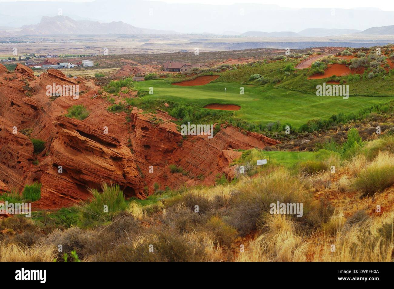 Golf course with red rock formations and desert vegetation Stock Photo ...