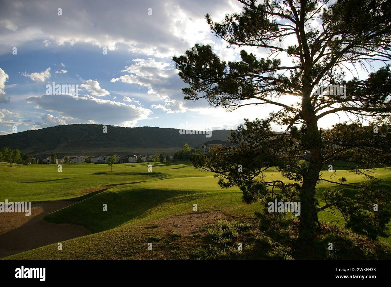 A Scenic golf course view at dusk with mountain panorama, Denver Stock ...