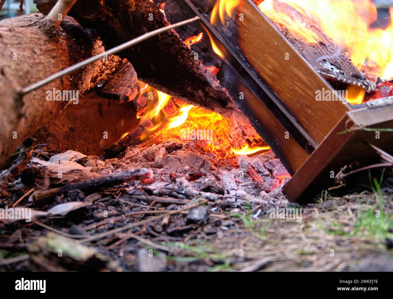 Wood burning on a garden bonfire Stock Photo - Alamy