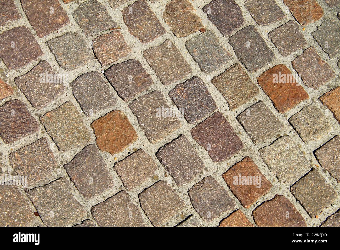 Old road made of cobblestones and stones. Vintage masonry, medieval ...