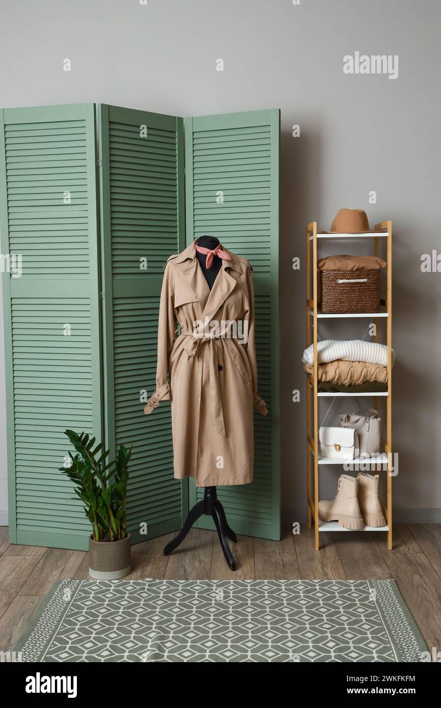 Interior of fashion designer's studio with mannequin, clothes and ...