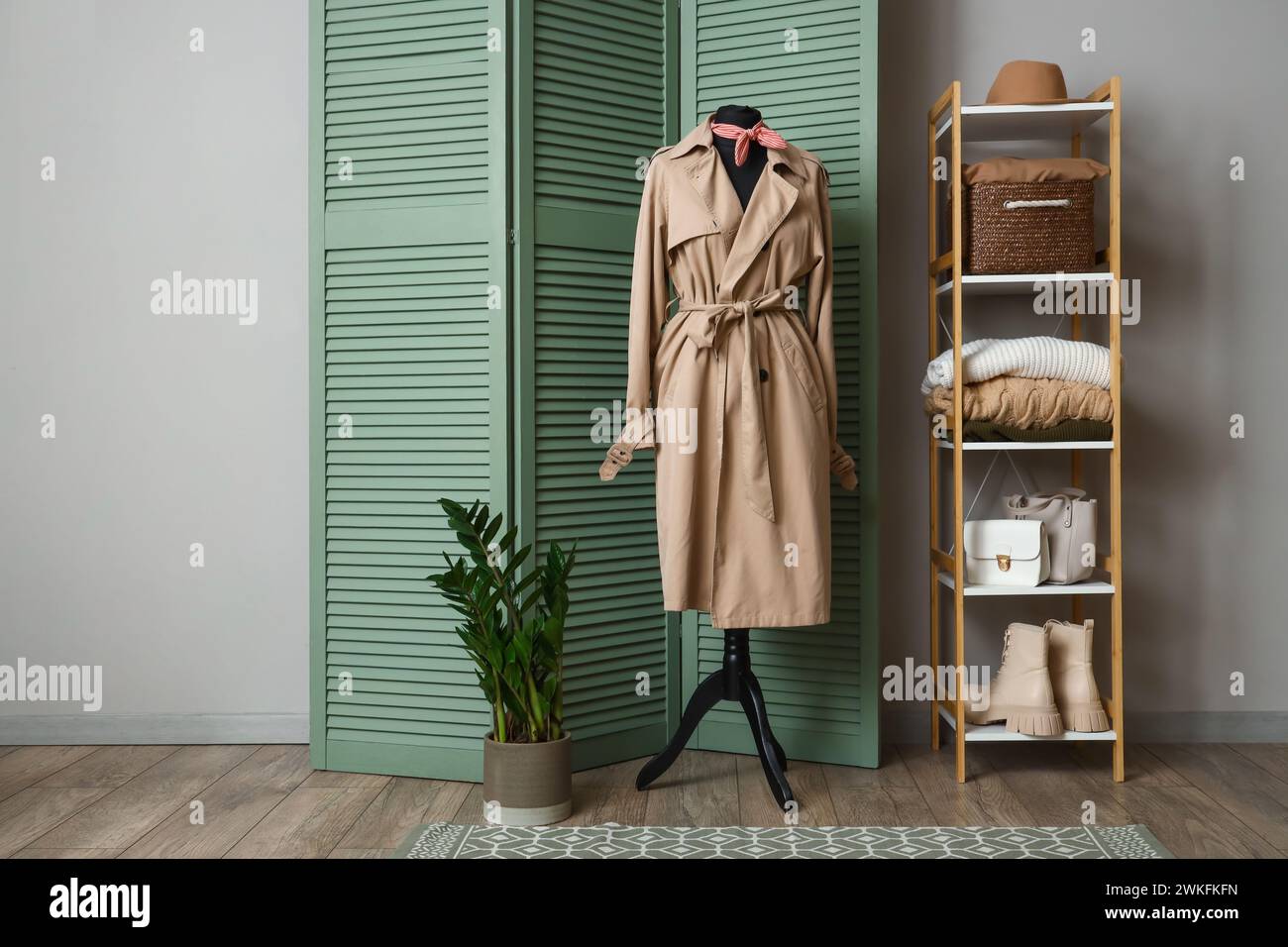 Interior of fashion designer's studio with mannequin, clothes and ...