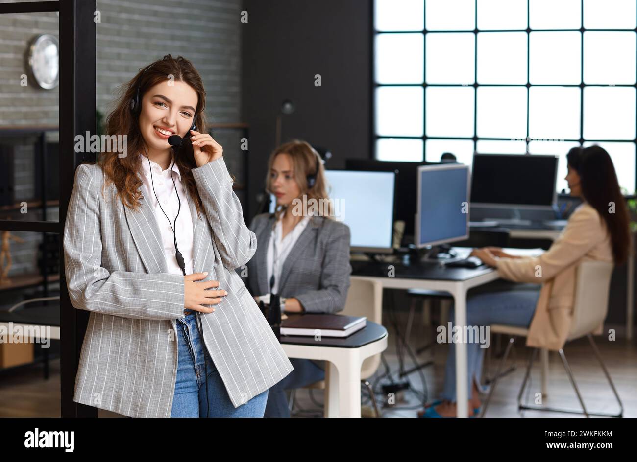 Female technical support agent in office Stock Photo - Alamy