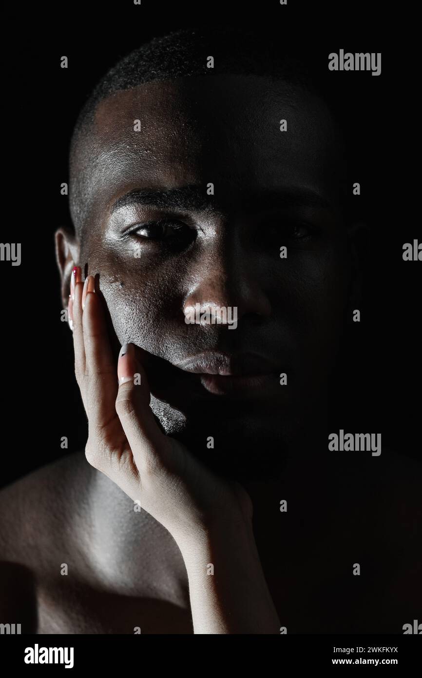 close-up of an African-American man's face with a Caucasian woman's ...