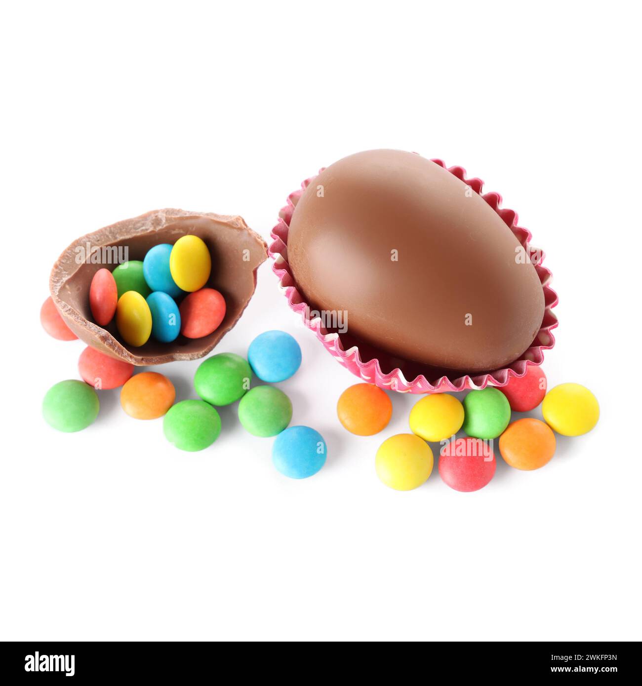 Sweet chocolate Easter egg with candies on white background Stock Photo ...