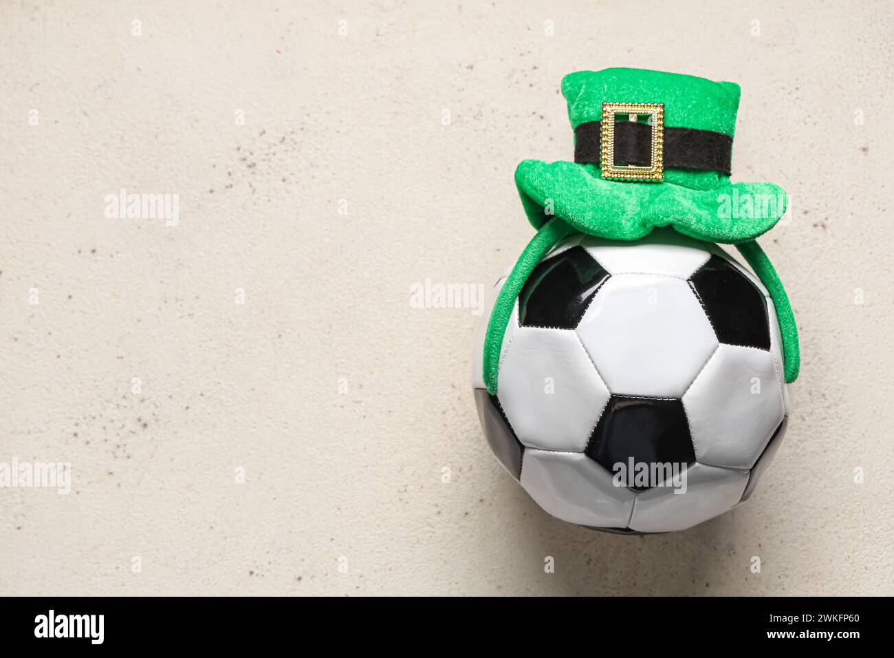 Soccer ball with leprechaun's hat on white grunge background. St ...
