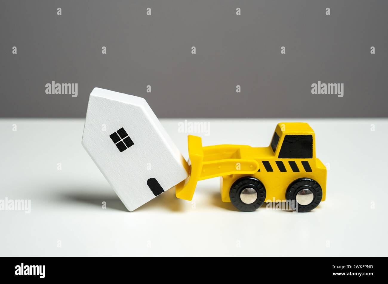 Demolition of a house with a bulldozer. The bulldozer intends to ...