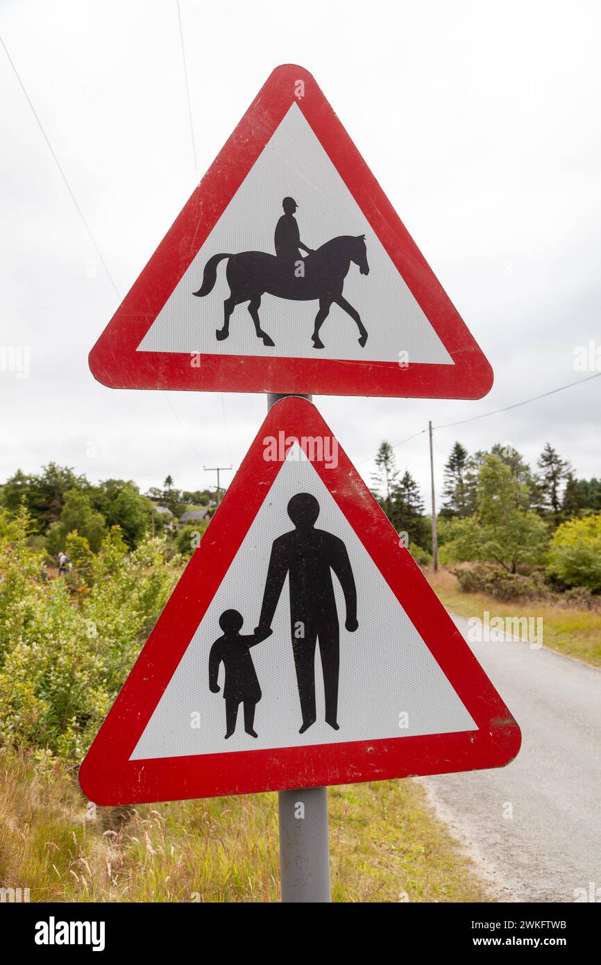 red triangle road sign warning of pedestrians walking Stock Photo - Alamy