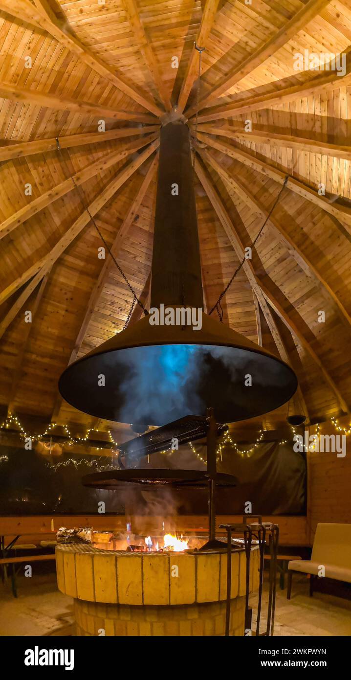 Big wooden grill house with beautiful wooden ceiling and giant grill in ...