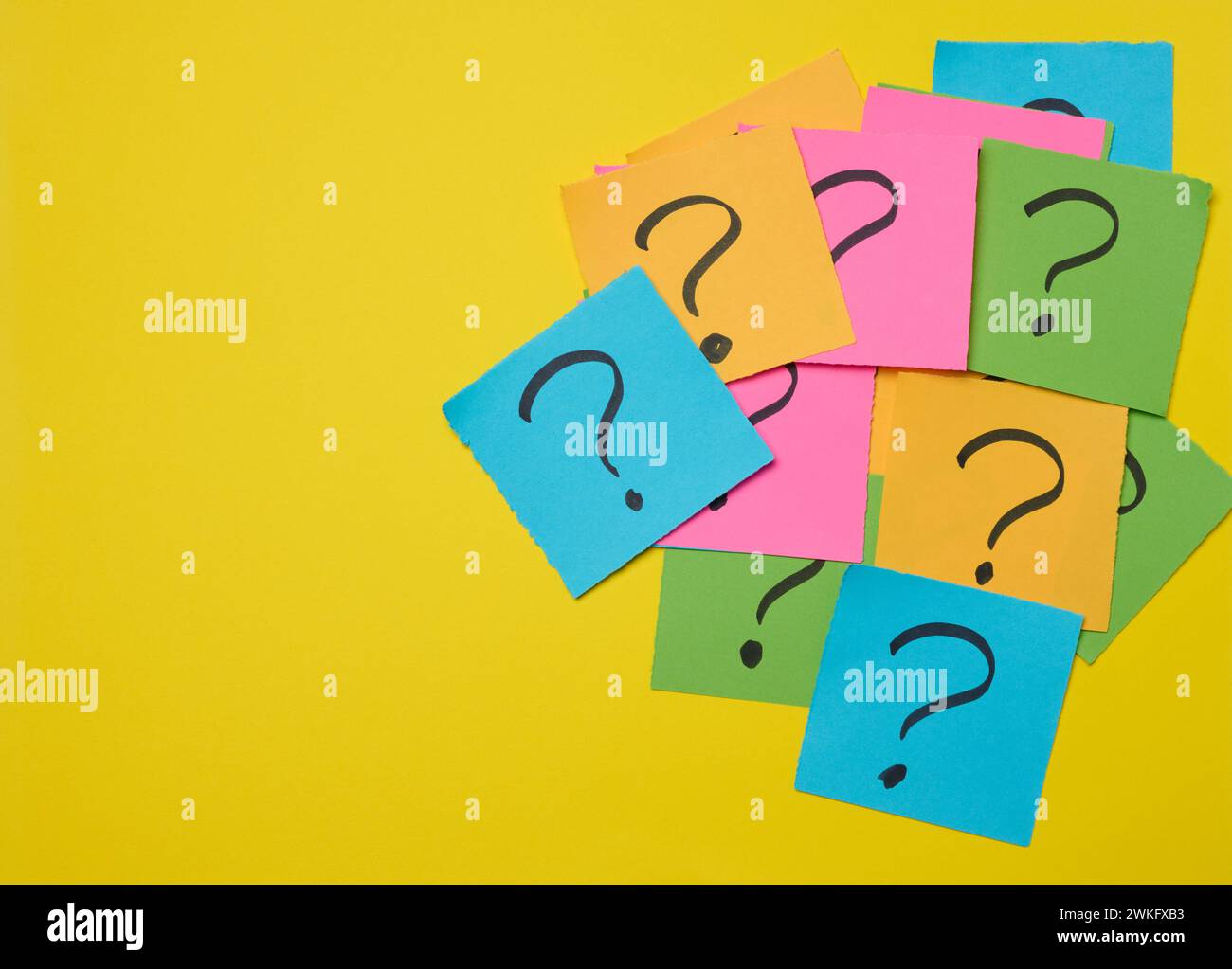 Drawn question marks on stickers, yellow background. Searching for ...