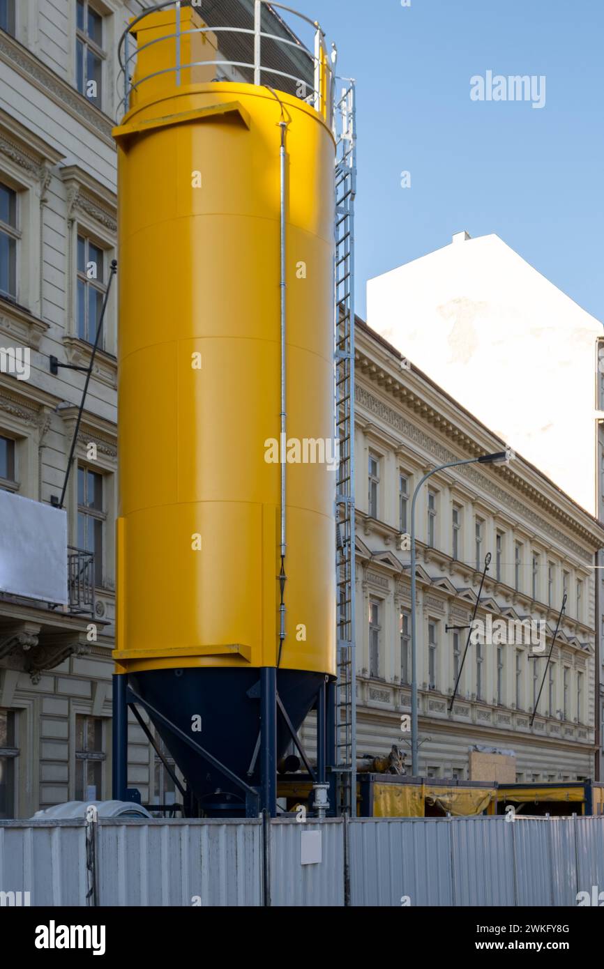 Concrete mixing silo located near a construction site in Europe ...