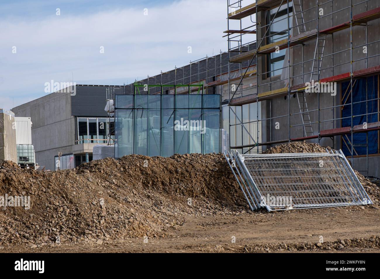 A palette with huge sealed glass windows at the construction site ...