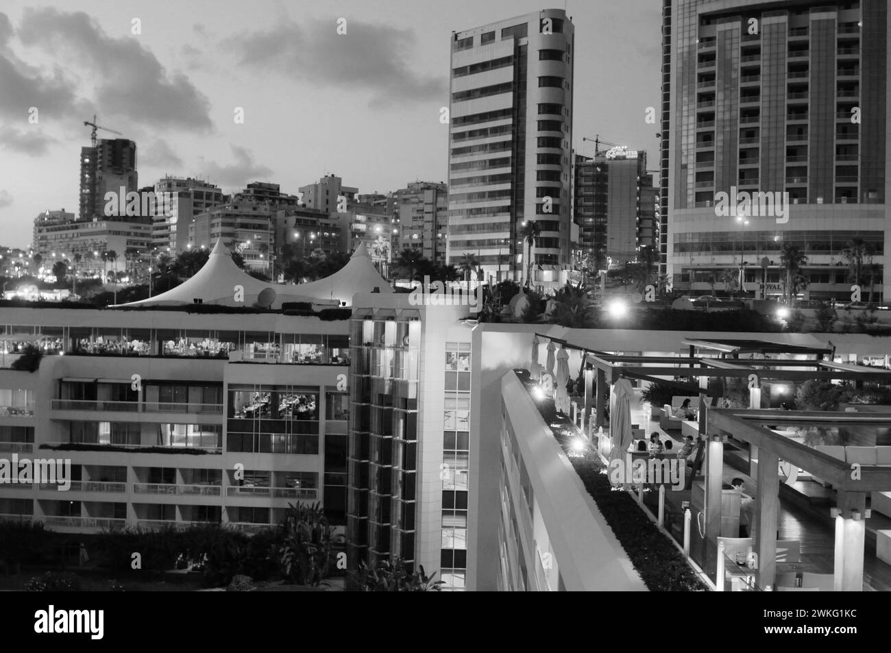 The bar on top of the luxury Mövenpick Hotel in Beirut at night is a ...