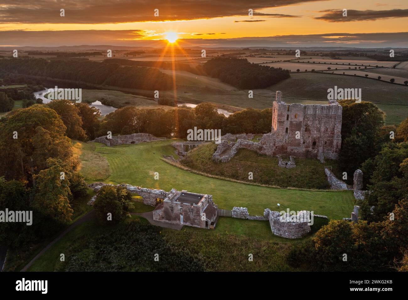 Summer sunset, Norham Castle beside the River Tweed on the Scottish ...