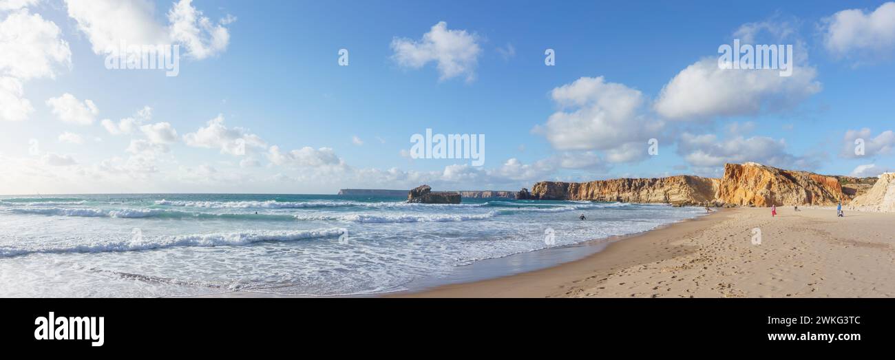 Panorama of rock formations in golden sunlight at Praia do Tonel beach ...