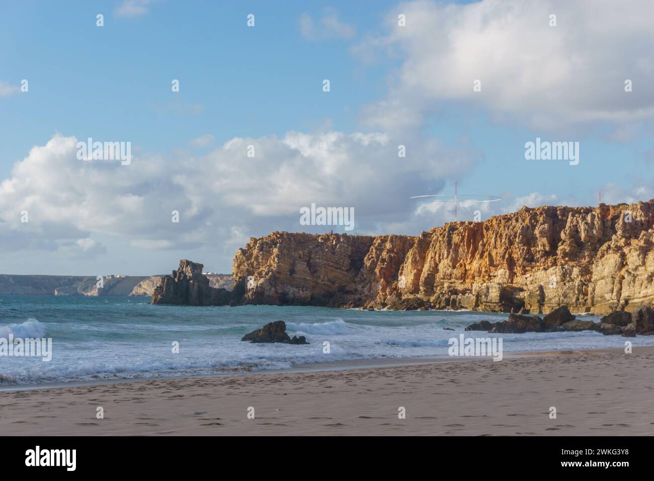 Rock formations in golden sunlight at Praia do Tonel beach, Sagres ...