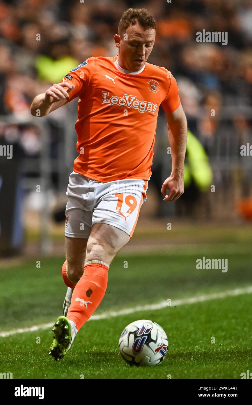 Shayne Lavery of Blackpool makes a break with the ball during the ...